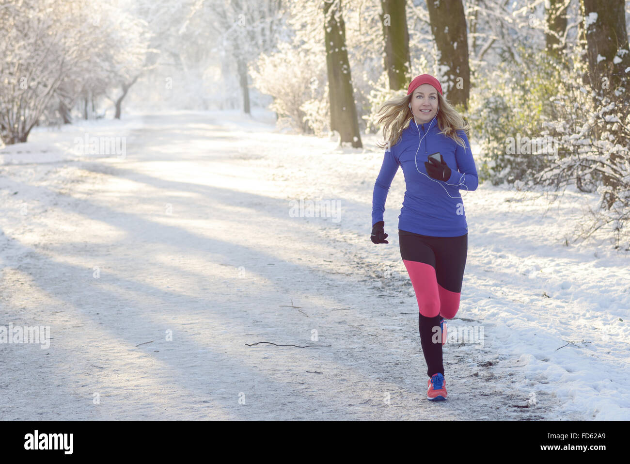 Half Body Shot of a Pretty Athletic Woman Jogging in winter with ...