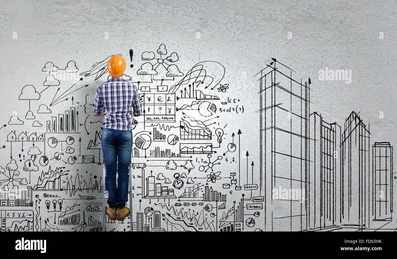 Image of man engineer against building project sketch Stock Photo - Alamy