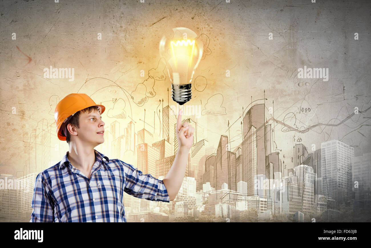 Image of man engineer against building project sketch. Idea concept ...