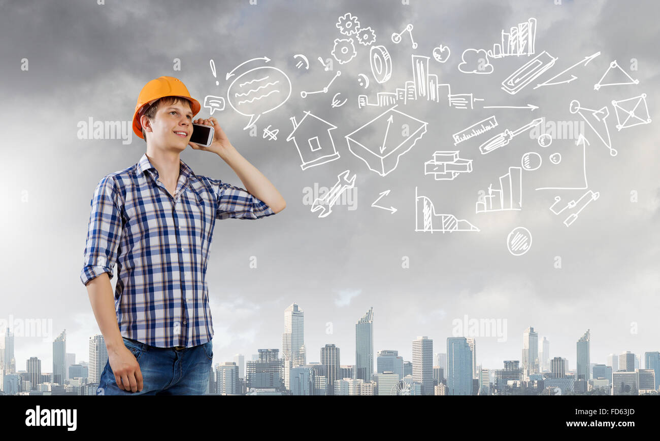 Image of man engineer talking on mobile phone Stock Photo - Alamy