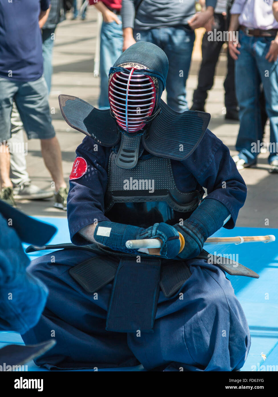 Kendo Fighter on His Knees match in Traditional Clothes and Bamboo ...