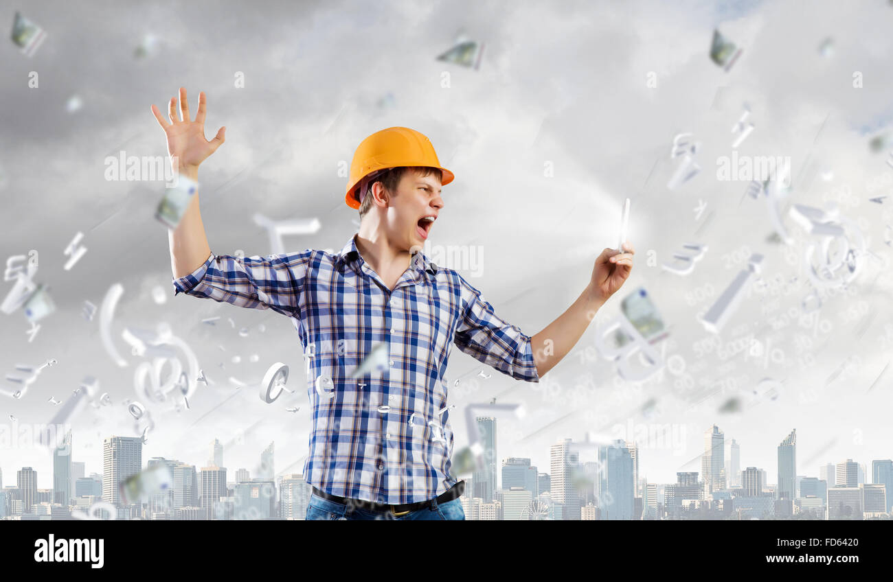 Image of young man engineer screaming angrily in mobile phone Stock ...