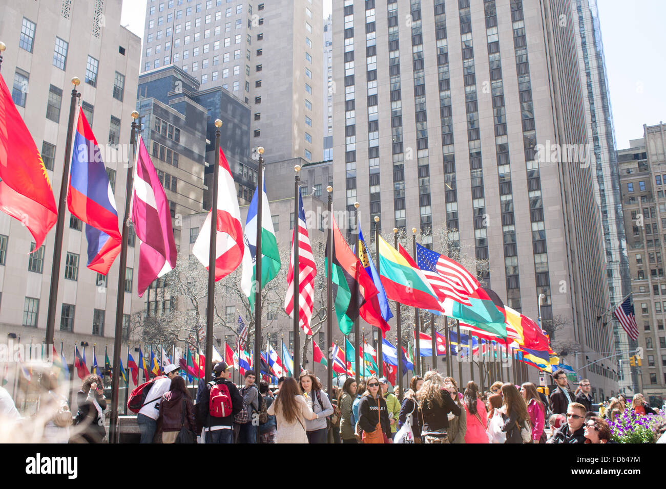 Crowd By International Flags In City Stock Photo - Alamy