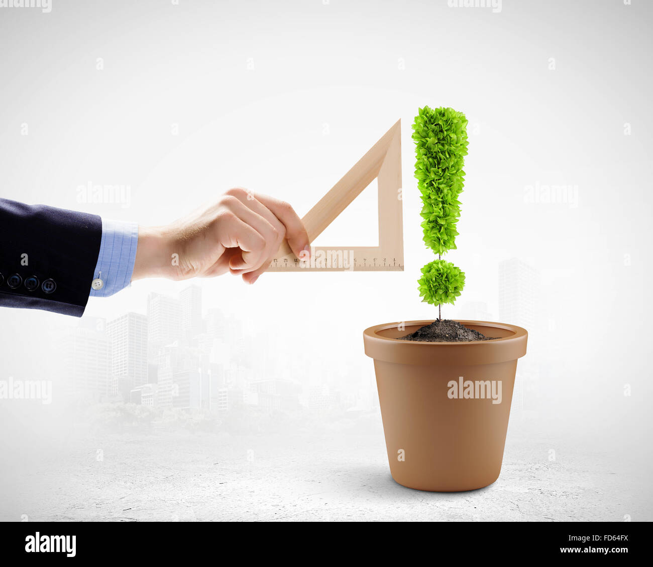 Image of plant in pot in shape of exclamation mark Stock Photo - Alamy
