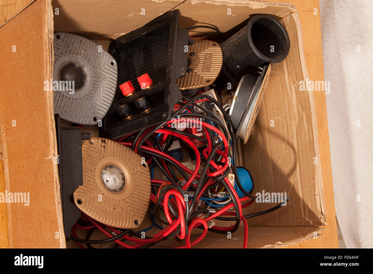 A cardboard box containing poor condition Tannoy tweeters, terminal ...