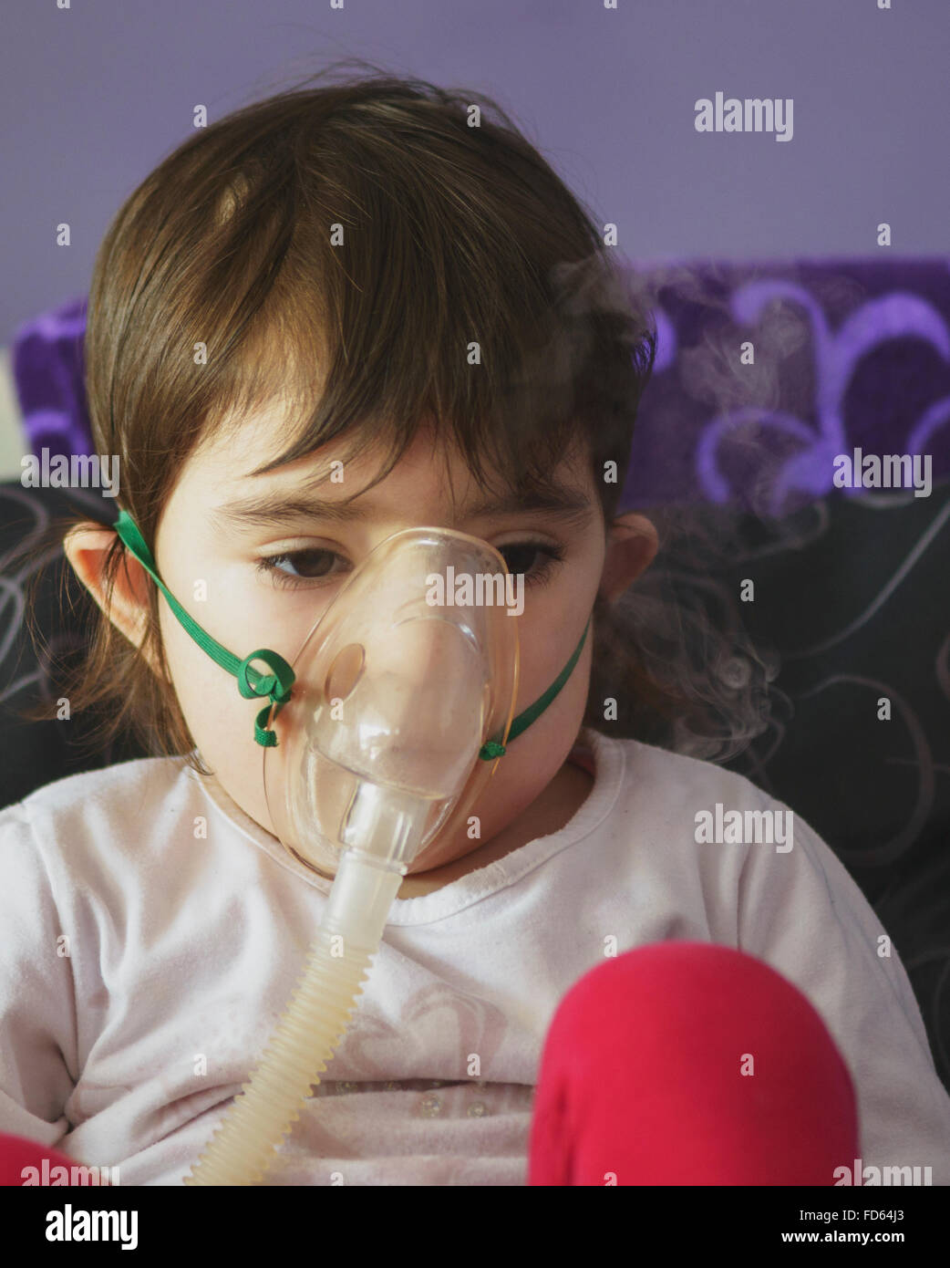 girl making inhalation with mask on her face Stock Photo - Alamy
