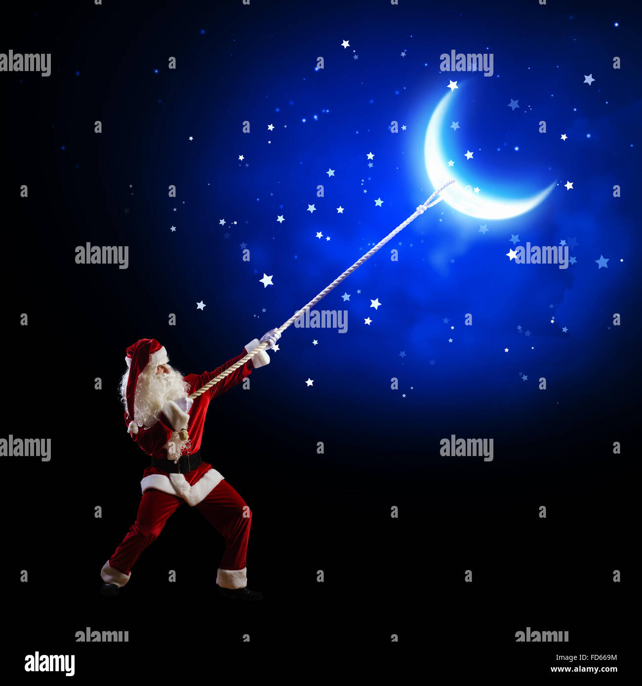 Image of Santa Claus pulling moon with rope Stock Photo - Alamy