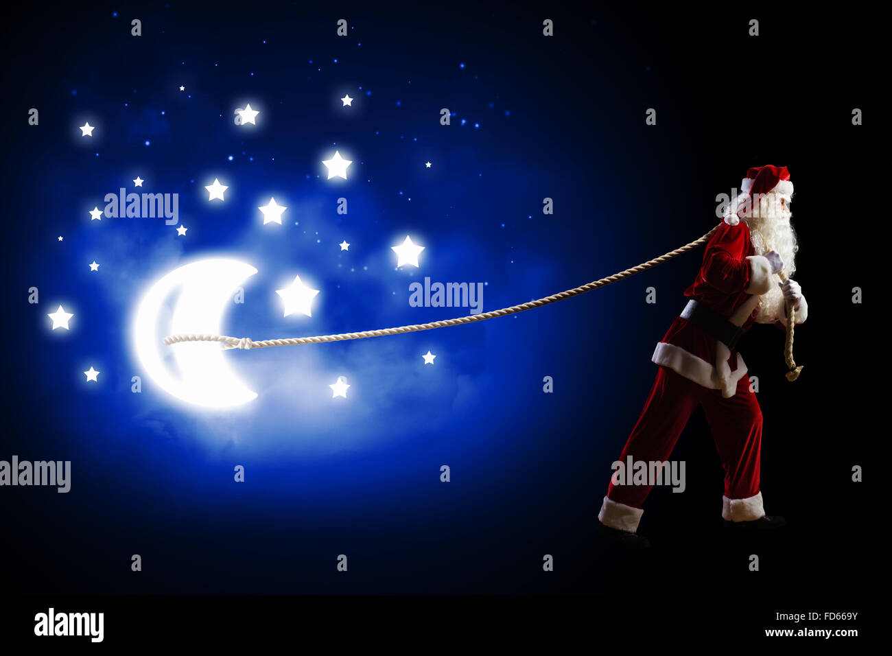 Image of Santa Claus pulling moon with rope Stock Photo - Alamy