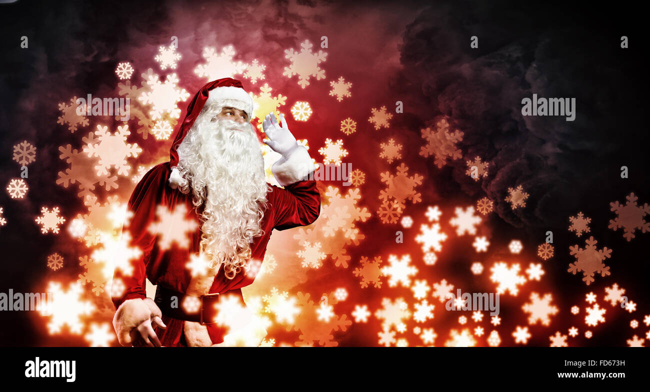 Image of Santa Claus in red costume against dark background Stock Photo ...