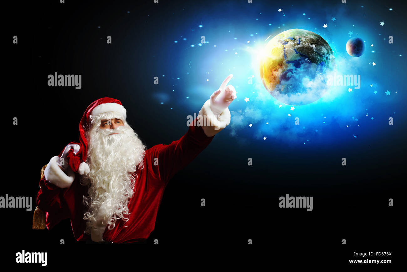 Image of Santa Claus in red costume with Earth planet Stock Photo - Alamy
