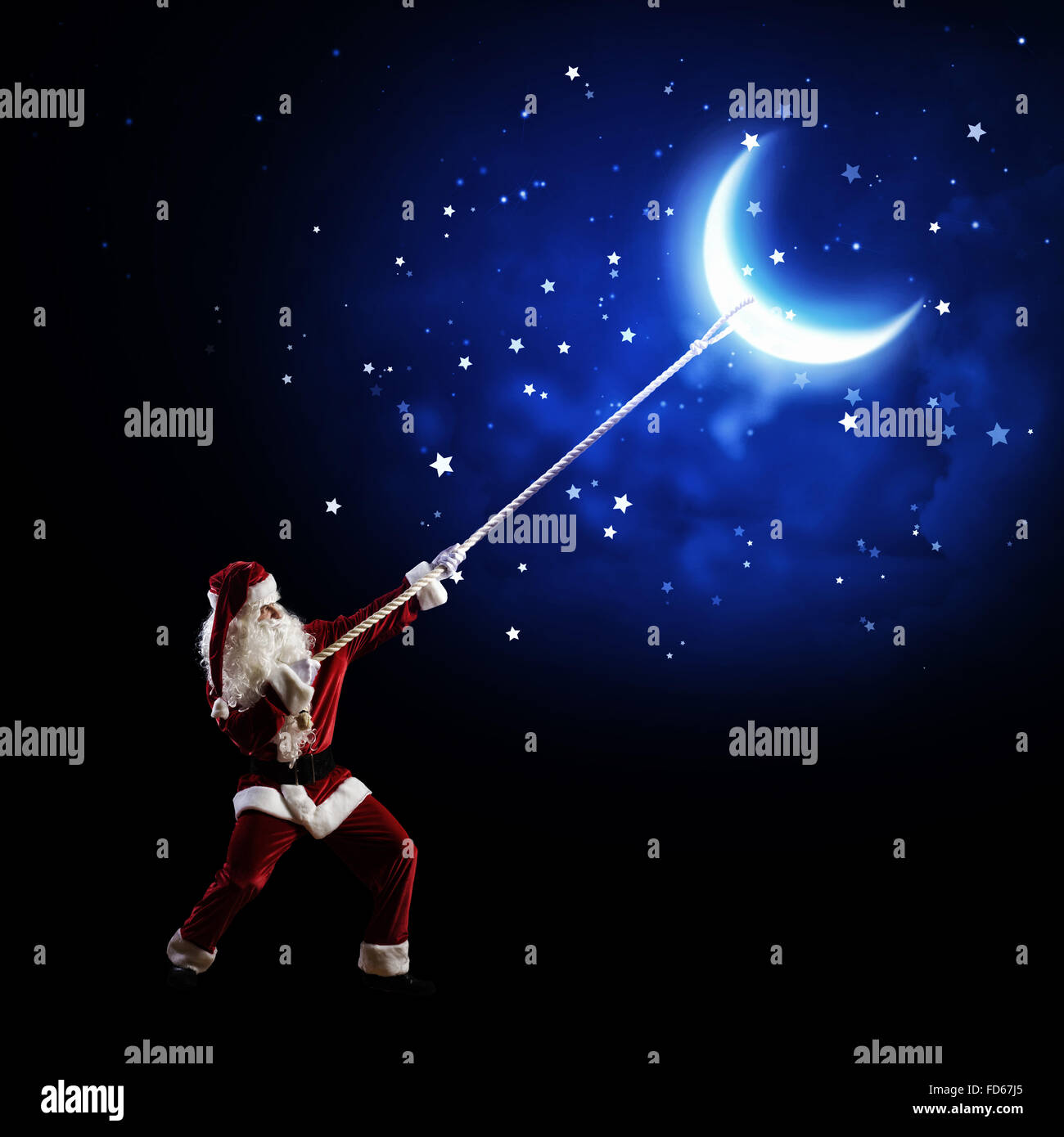 Image of Santa Claus pulling moon with rope Stock Photo - Alamy