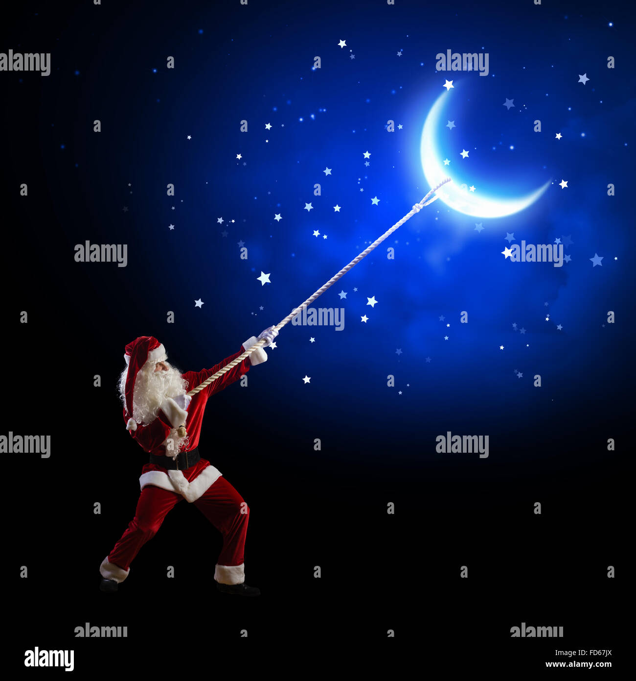 Image of Santa Claus pulling moon with rope Stock Photo - Alamy