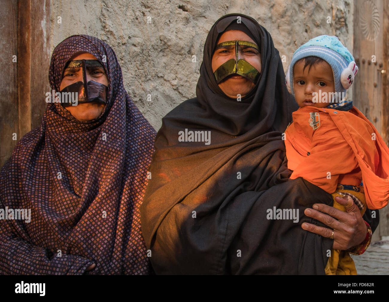 bandari women wearing the traditional masks called the burqas with a ...
