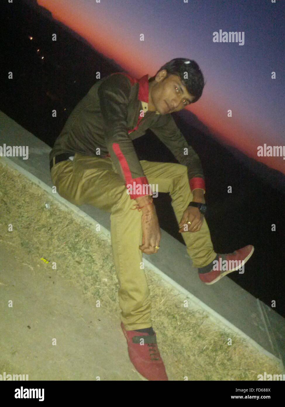 Man Sitting On Ledge High Resolution Stock Photography and Images - Alamy