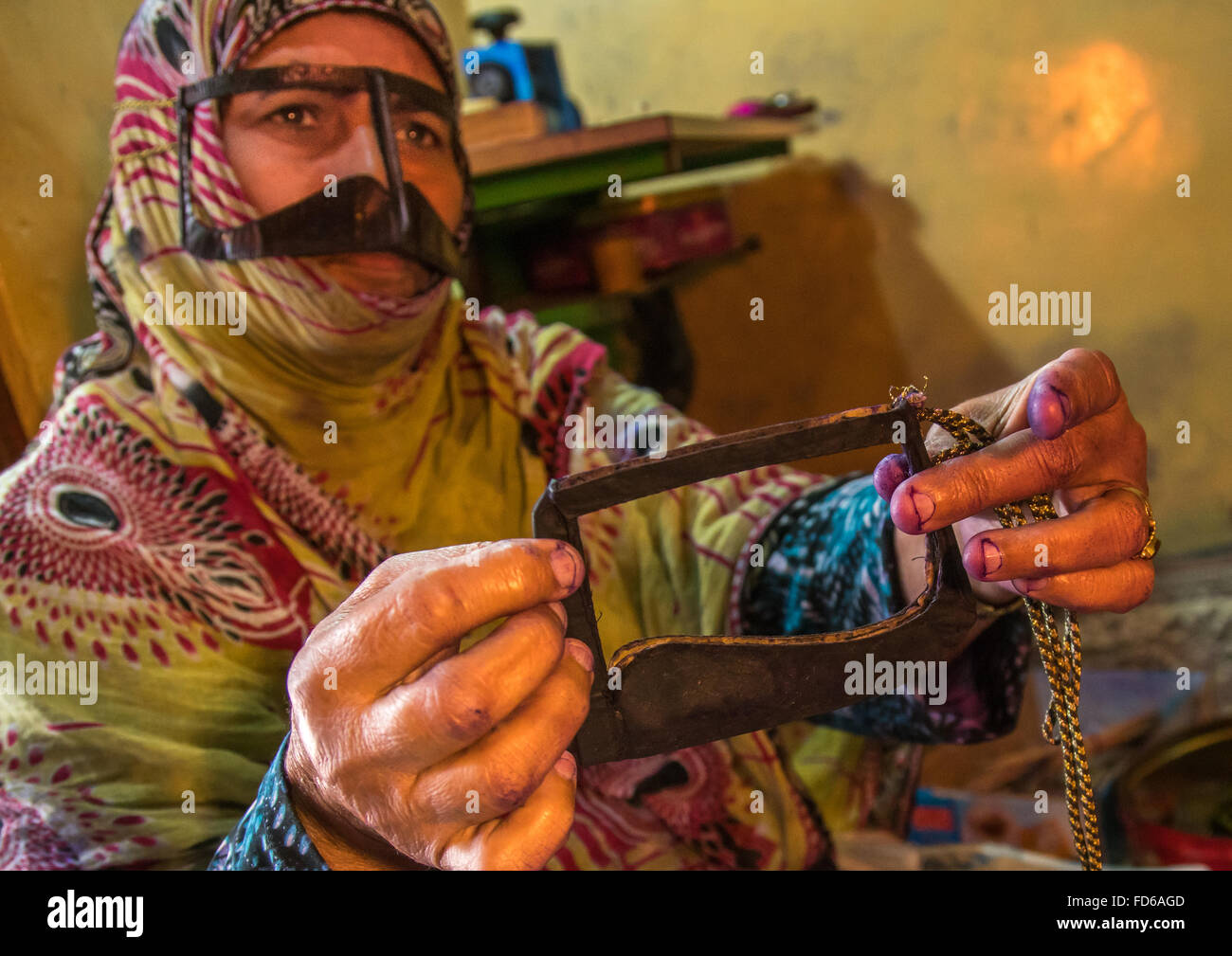 a bandari woman wearing a traditional mask called the burqa, Qeshm ...