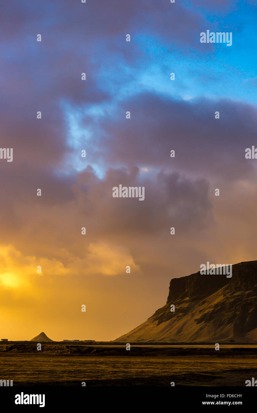 Dramatic and beautiful sunset over Icelandic landscape with Cliff ...