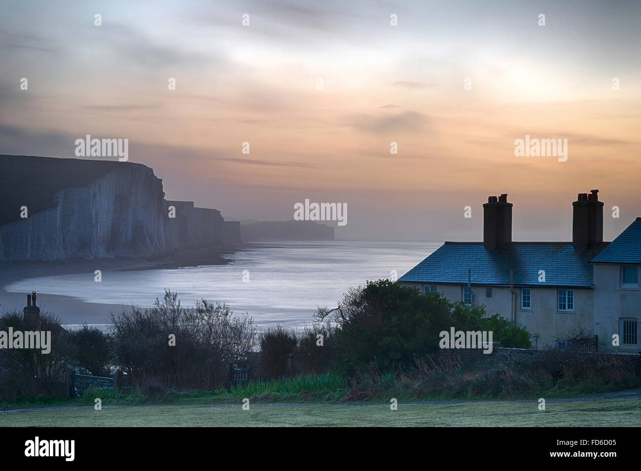 Stunning foggy Winter sunrise Seven Sisters cliffs landscape in England ...