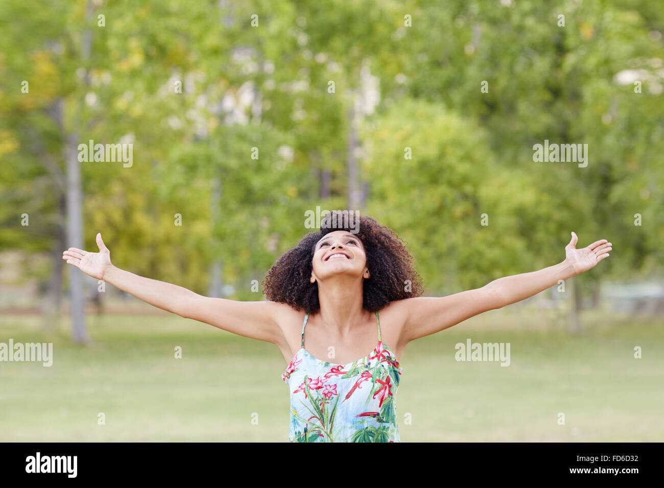 Young woman celebrating her freedom in nature Stock Photo - Alamy