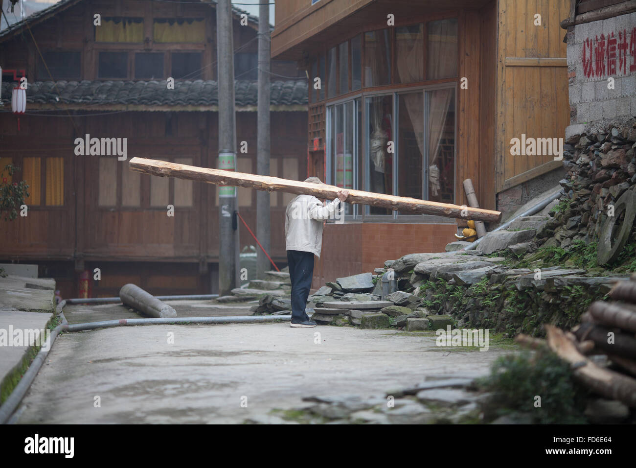Carrying log of wood hi-res stock photography and images - Alamy