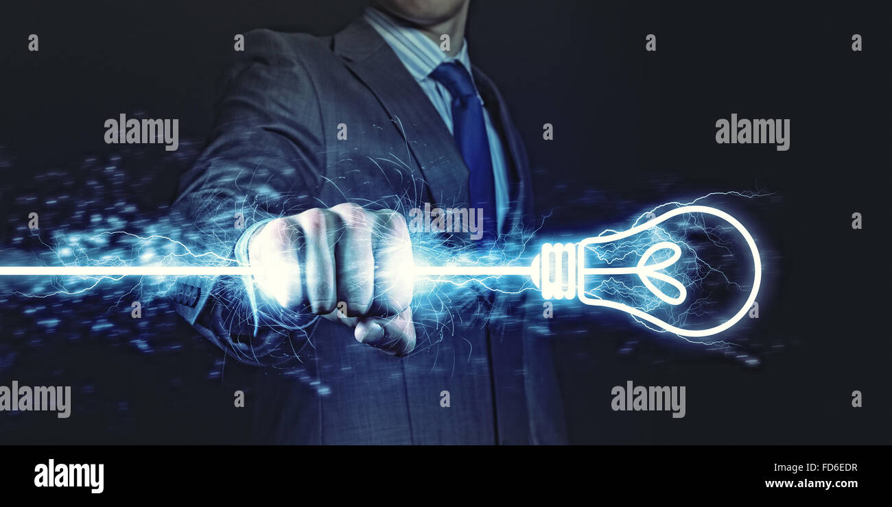 Businessman holding lightning in fist hi-res stock photography and ...
