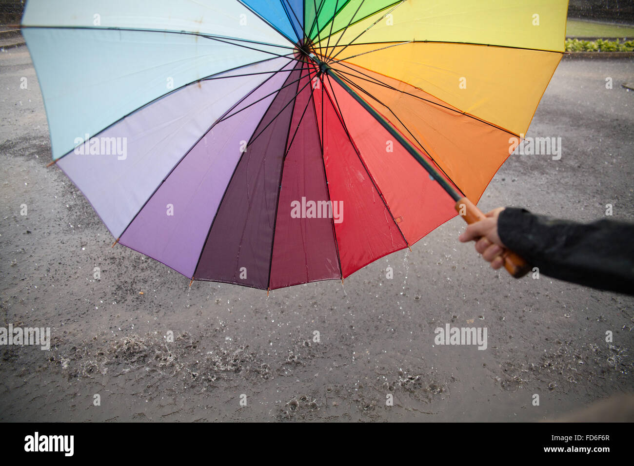 Person with umbrella hi-res stock photography and images - Alamy