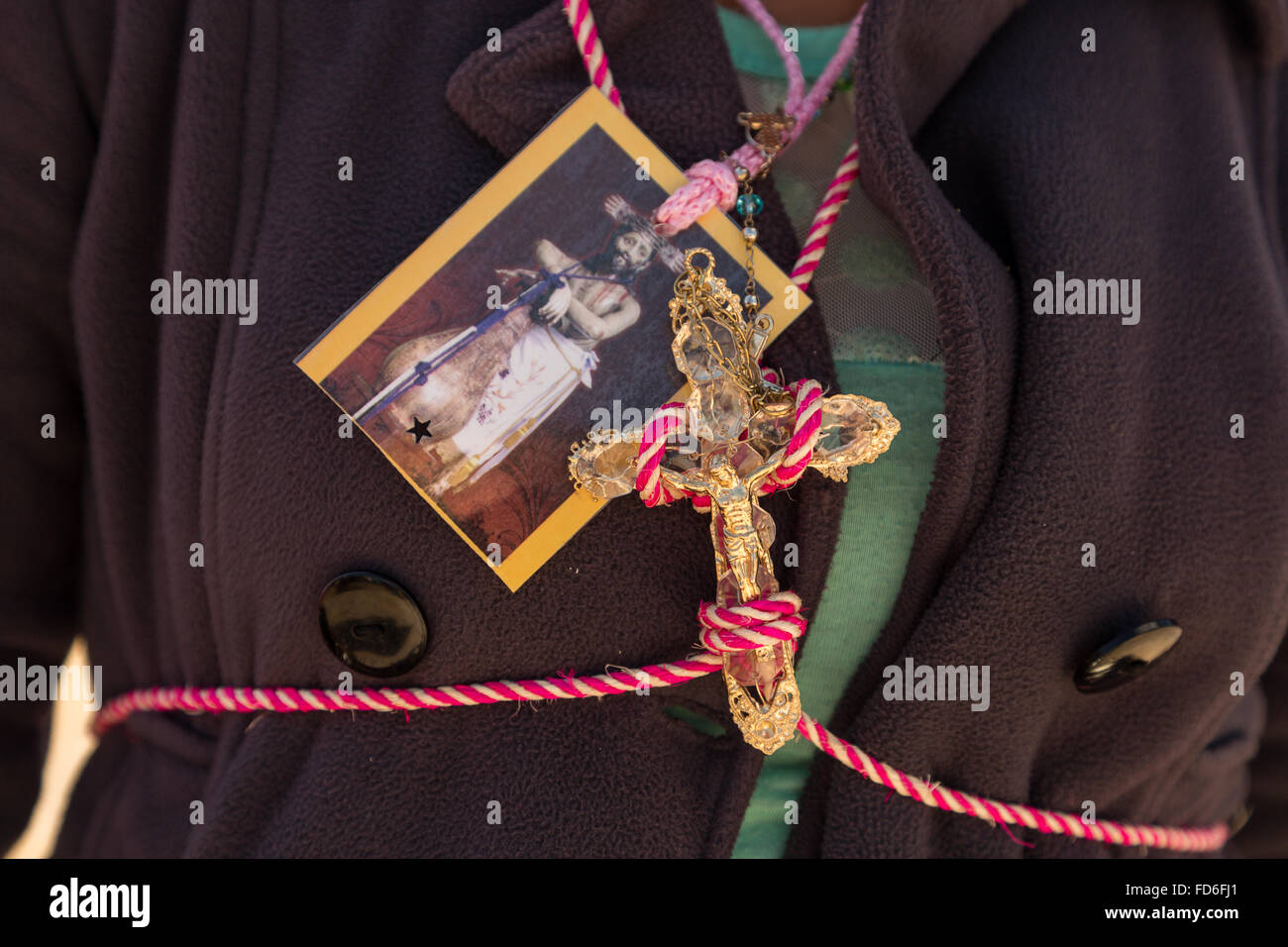 Indigenous pilgrims wearing religious icon and crucifix outside the ...