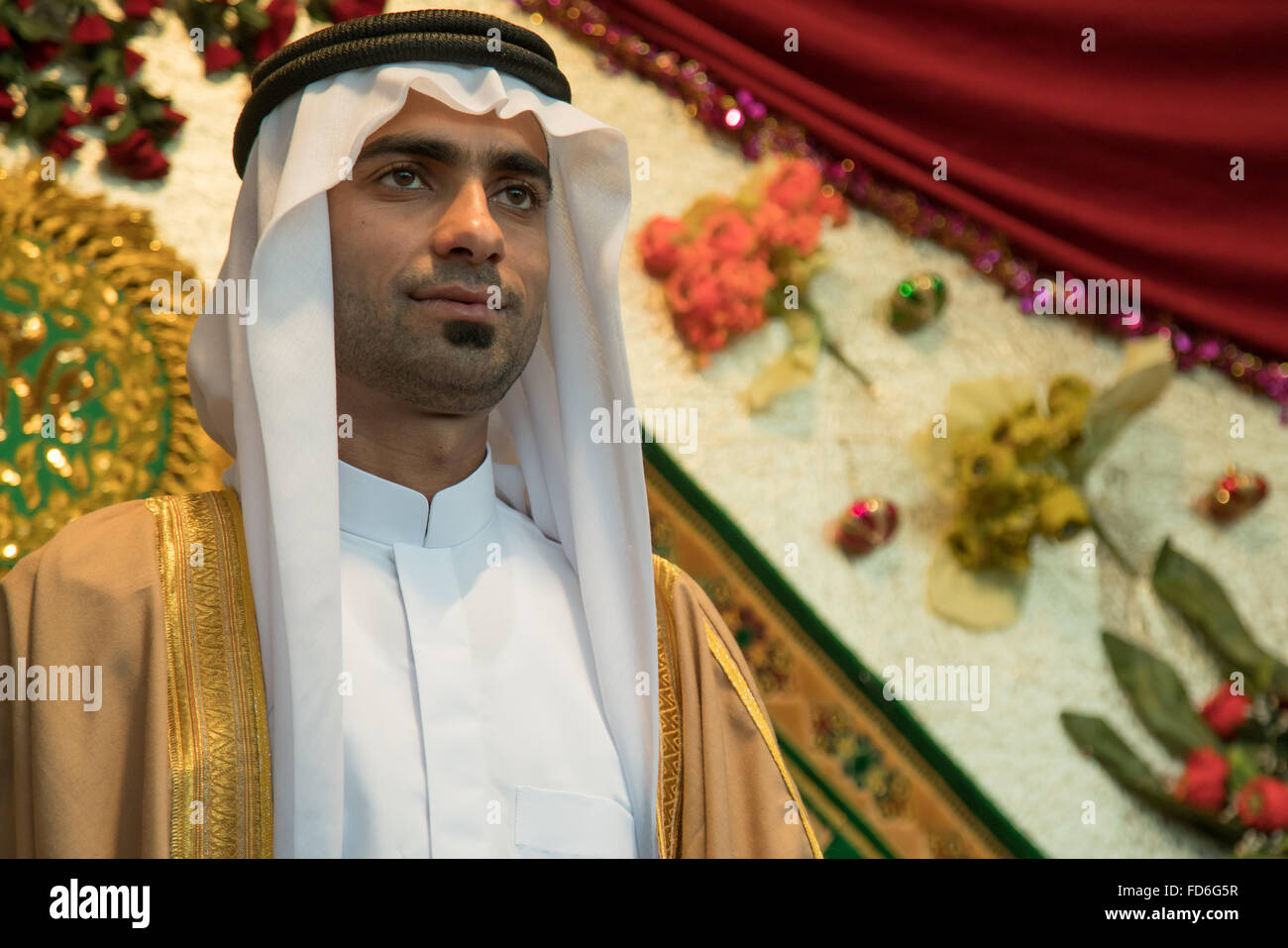 groom posing with his new traditional clothes during a wedding ceremony ...