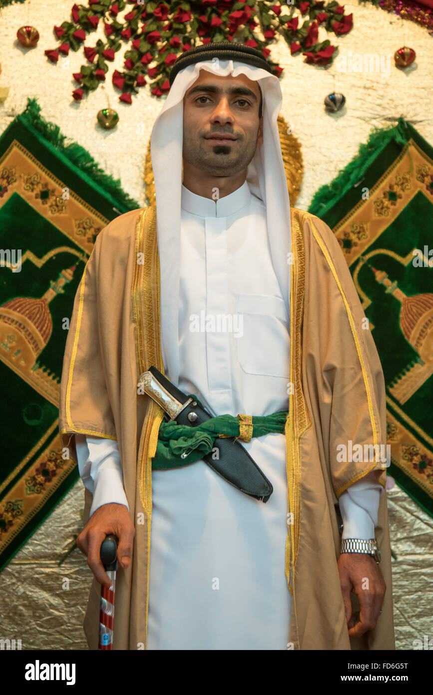 groom posing with his new traditional clothes during a wedding ceremony ...
