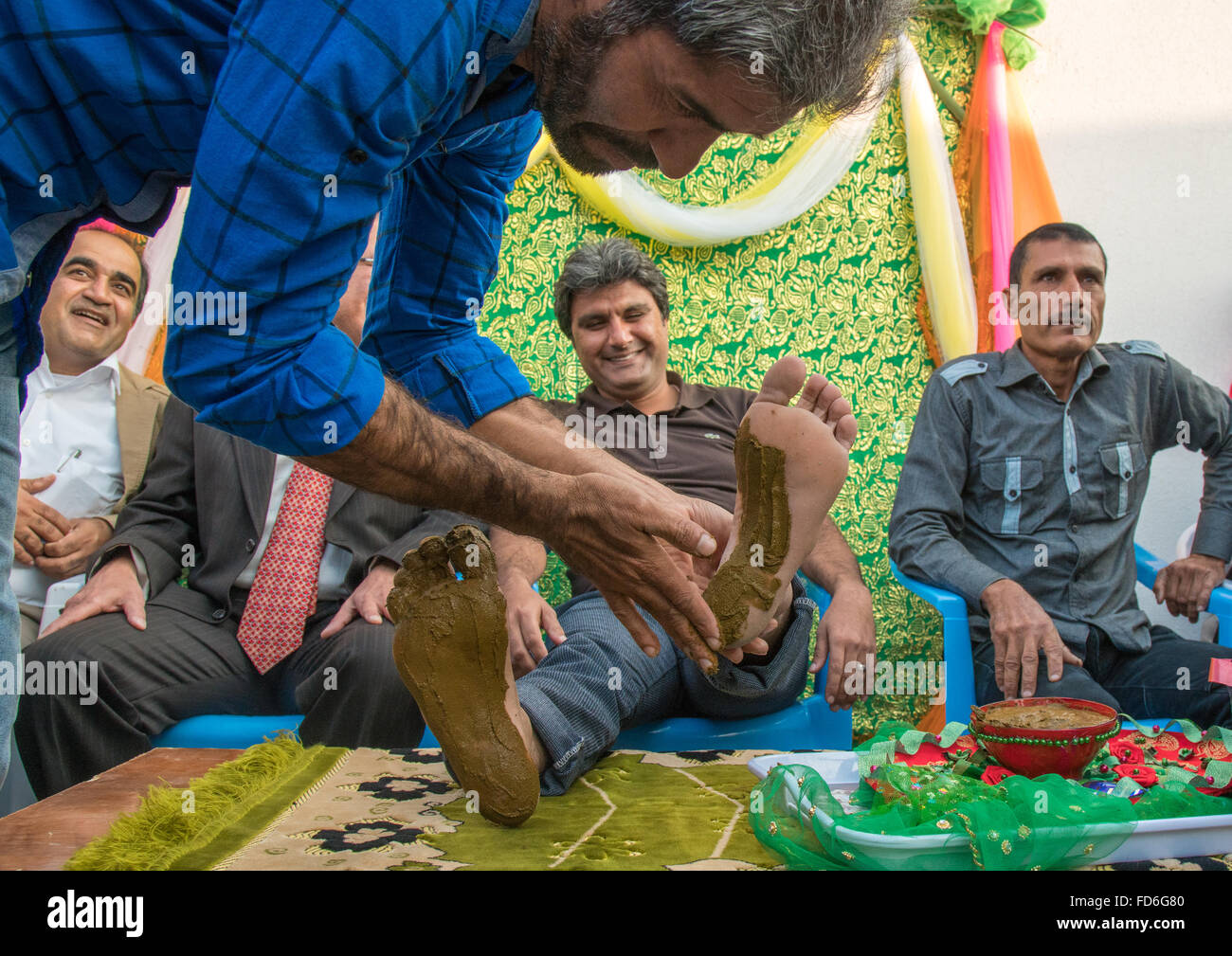 groom being covered with henna during his wedding ceremony, Hormozgan ...