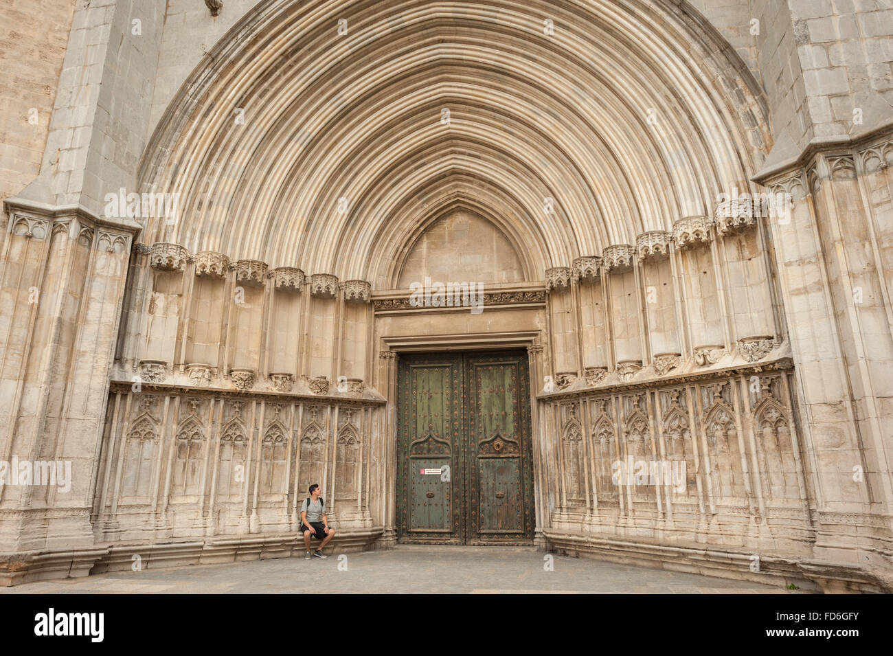Man sitting arch door arch hi-res stock photography and images - Alamy