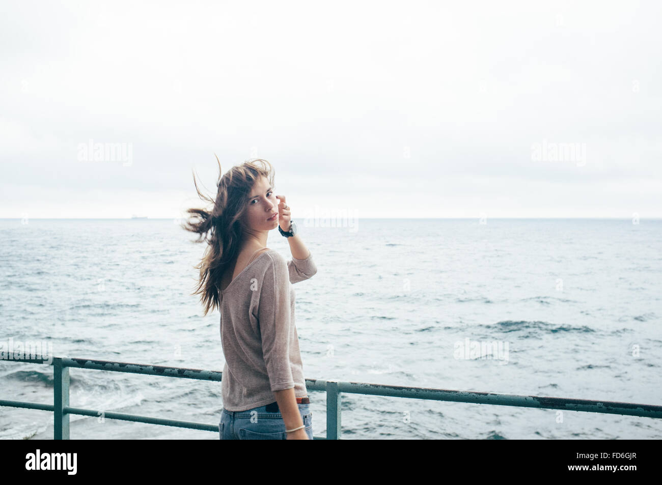 Woman looking over shoulder hair hi-res stock photography and images ...