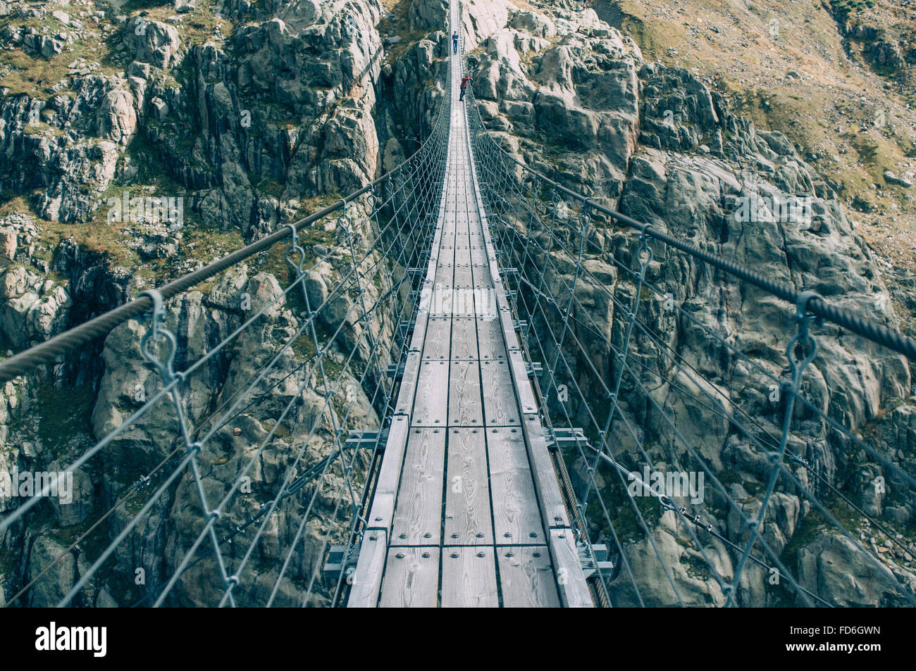Rope Bridge Over Rocks Stock Photo - Alamy