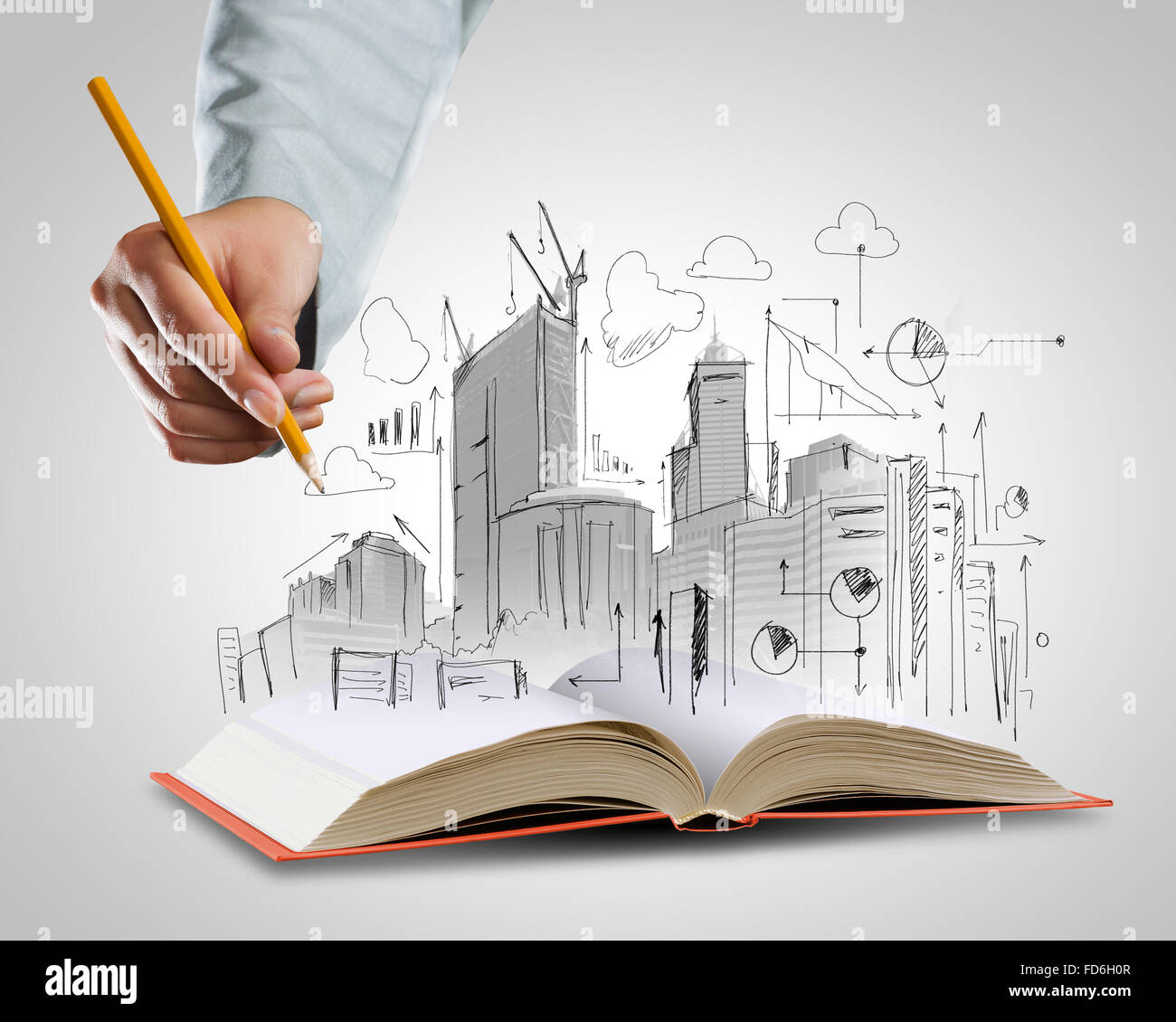 Opened book and hand drawing building sketches Stock Photo - Alamy