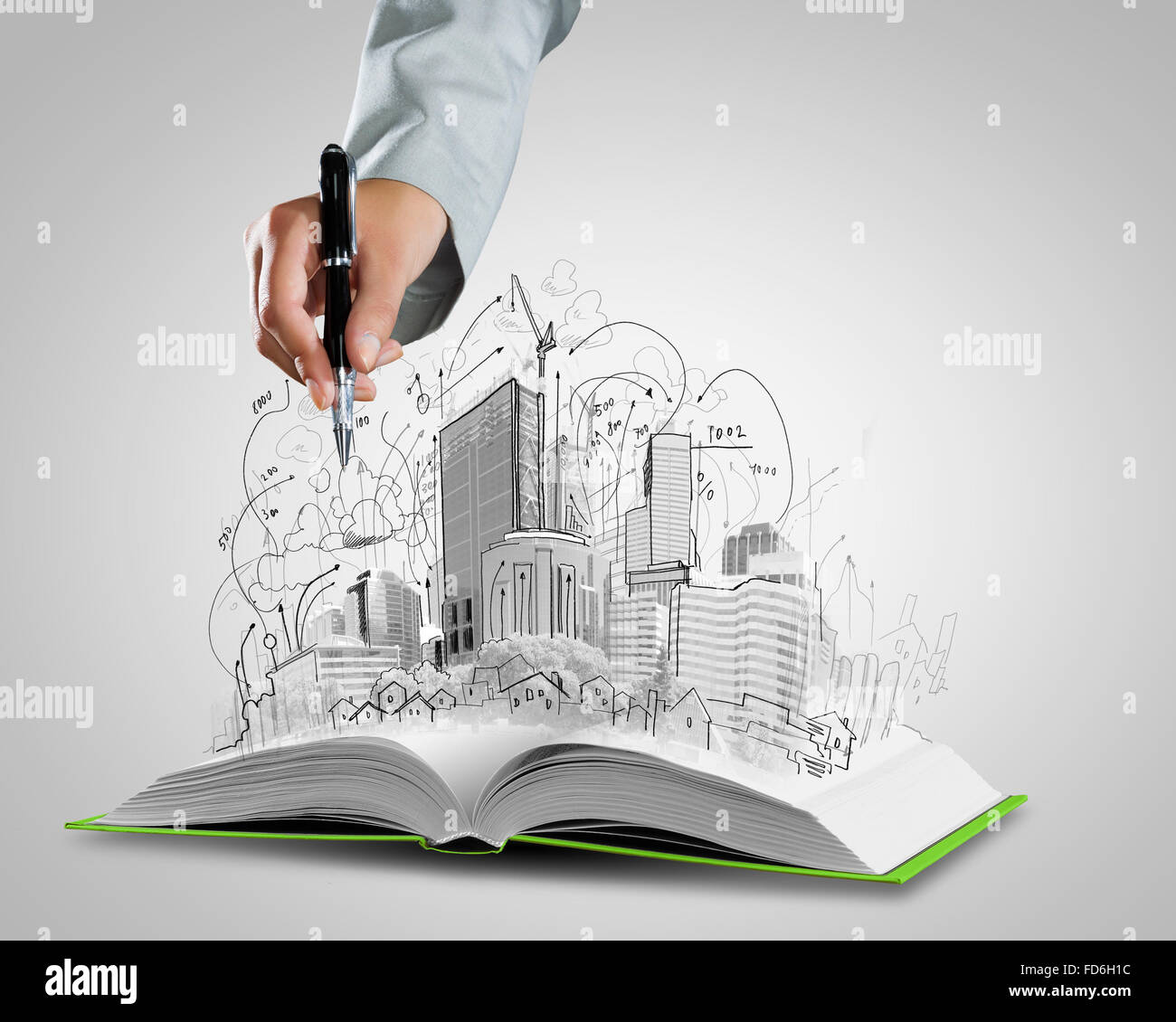 Opened book and hand drawing building sketches Stock Photo - Alamy