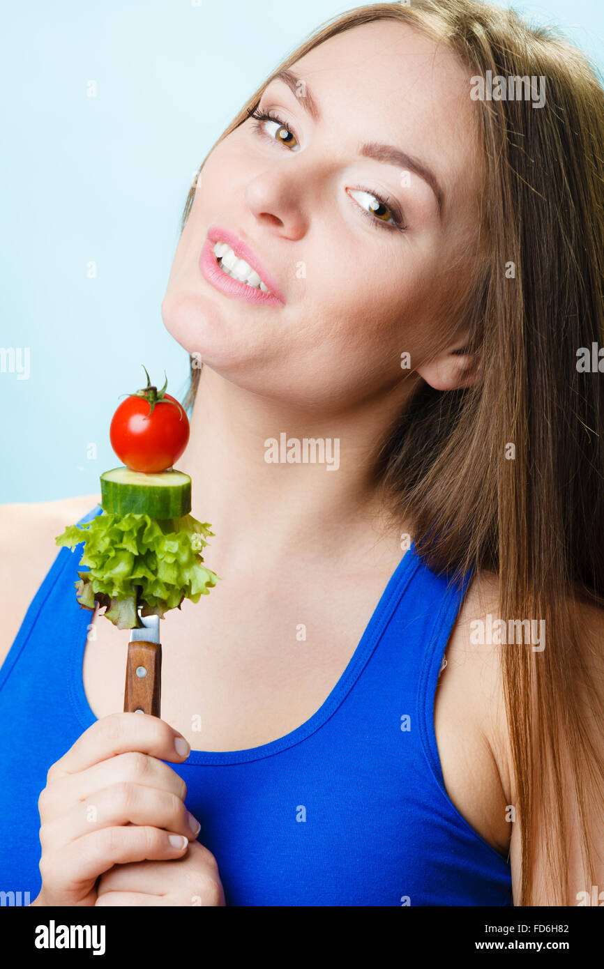 Vegetarian girl. Diet concept. Fit woman holding stack of vegetables on ...