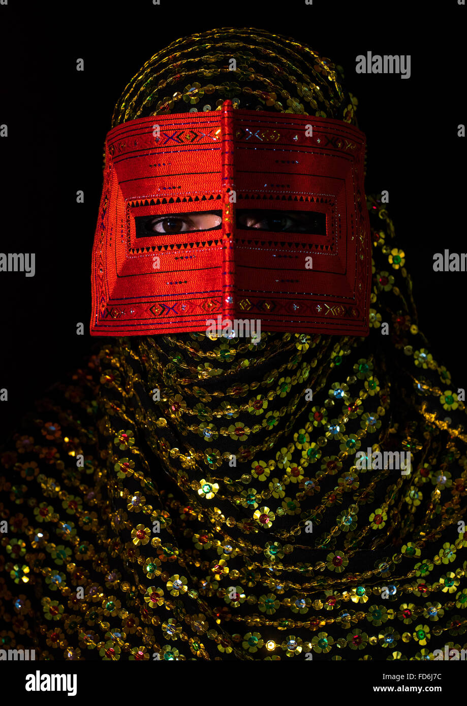 a bandari woman wearing a traditional mask called the burqa, Hormozgan ...