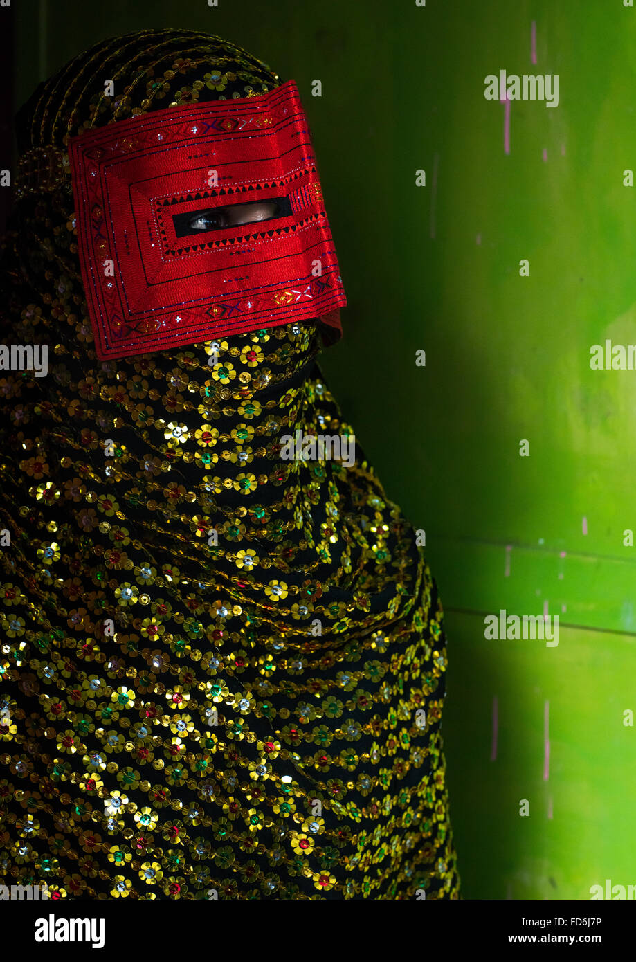 a bandari woman wearing a traditional mask called the burqa, Hormozgan ...