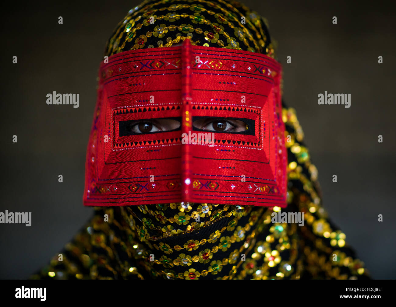 a bandari woman wearing a traditional mask called the burqa, Hormozgan ...