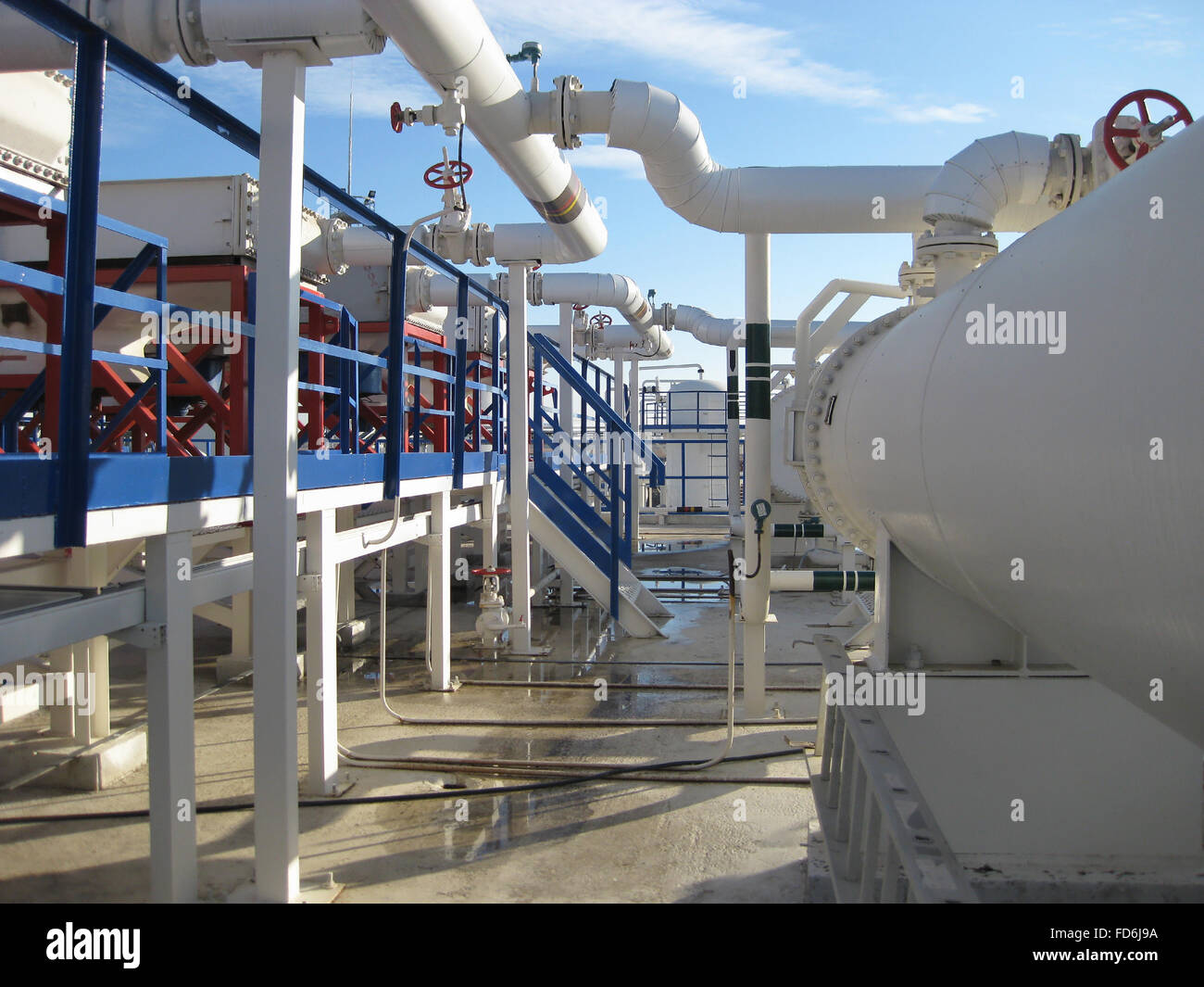 Steel service platform and stairs. Equipment refinery Stock Photo - Alamy