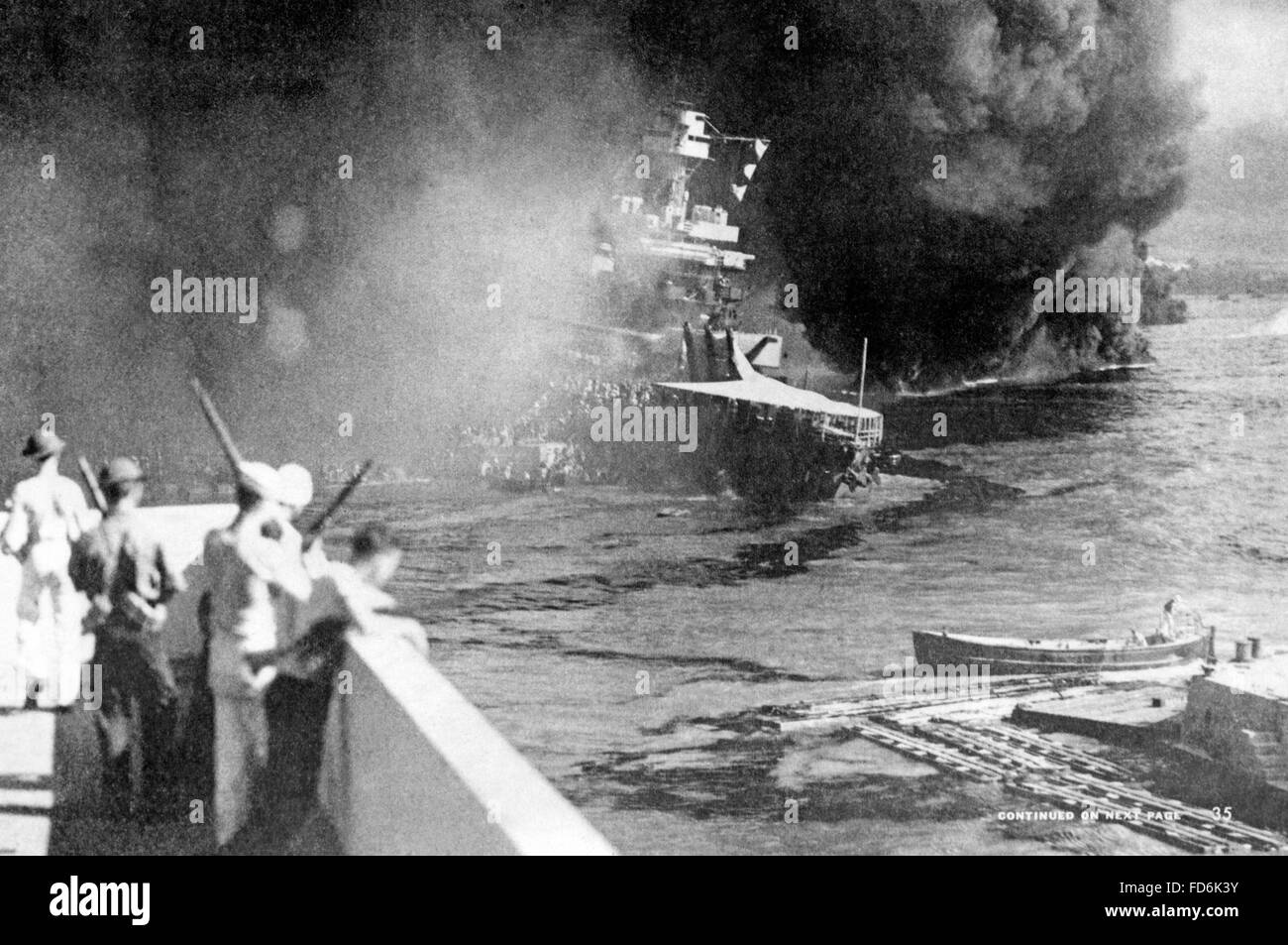 Battleships burning at pearl harbor hi-res stock photography and images ...