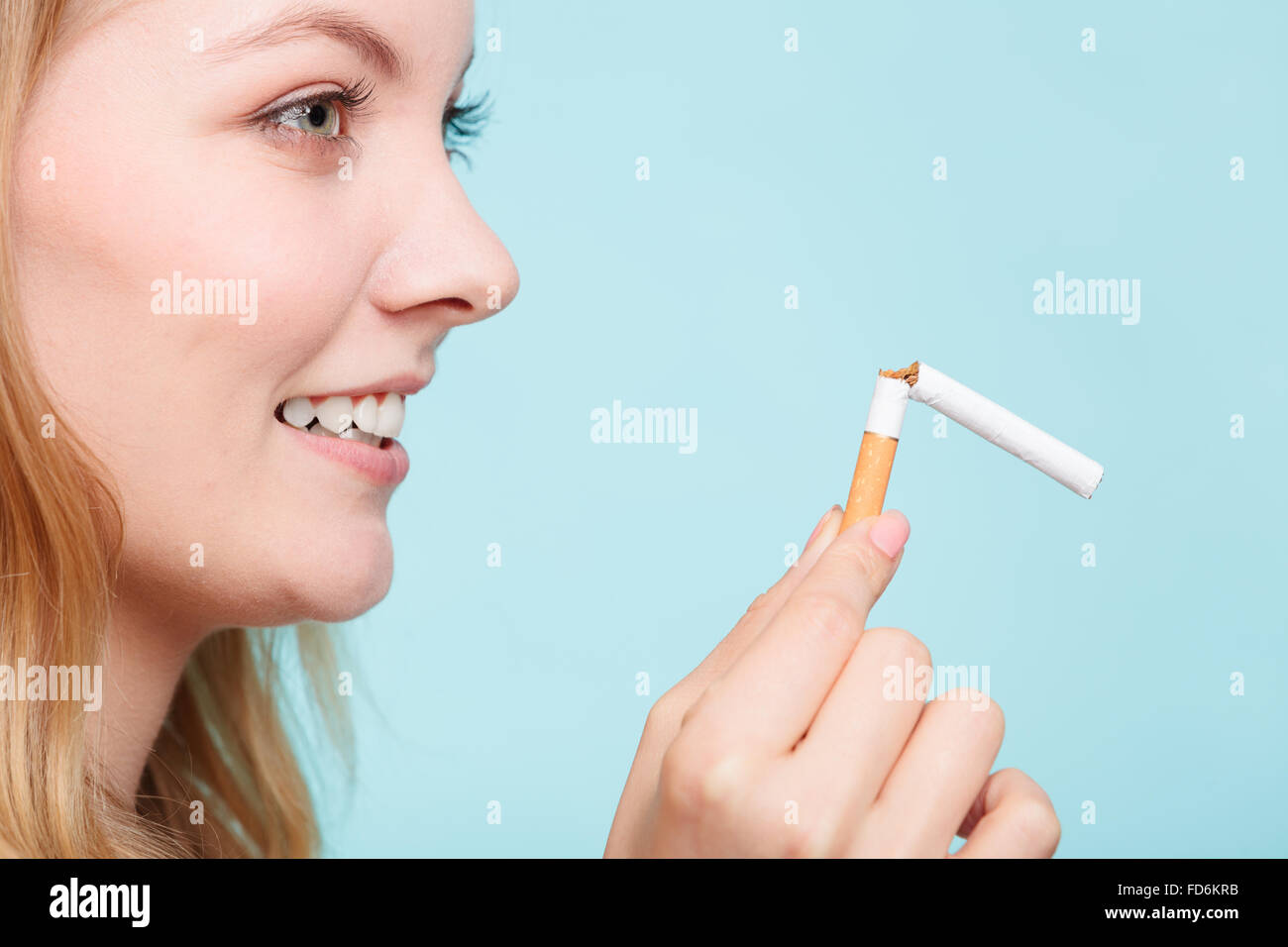 Smilling pretty girl breake down cigarette. Winning with addicted ...