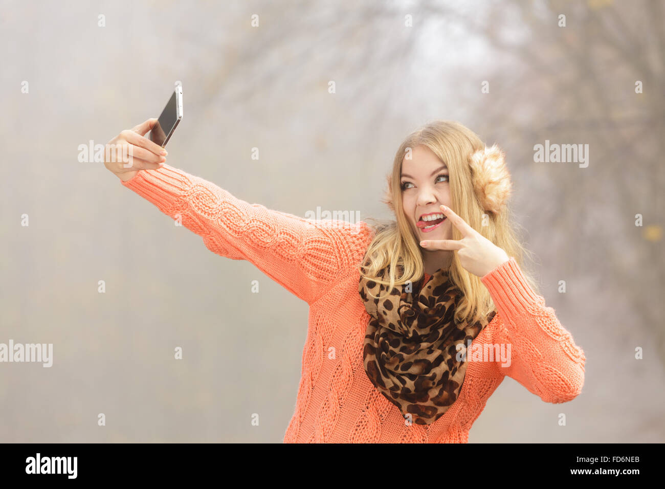 Happy fashion woman in fall autumn park taking selfie self photo ...