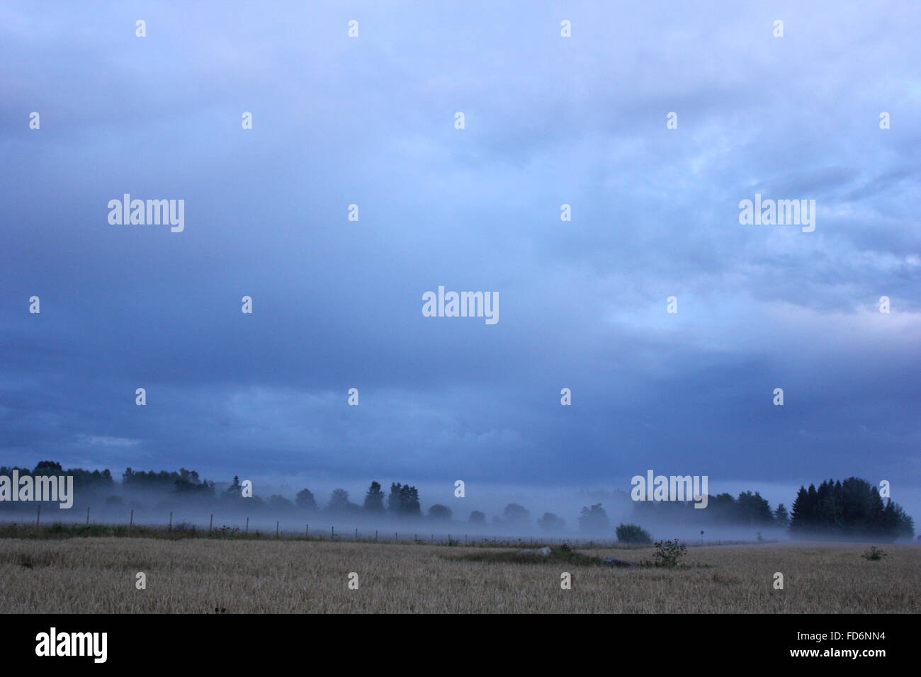 Clouds Over Field Stock Photo - Alamy