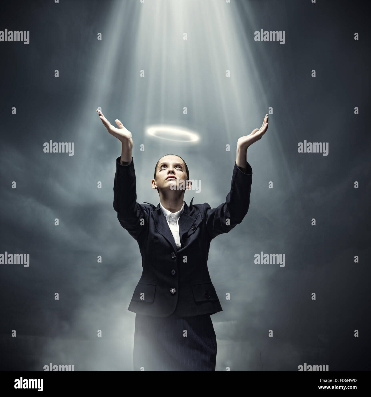 Young crying businesswoman with halo above head Stock Photo - Alamy