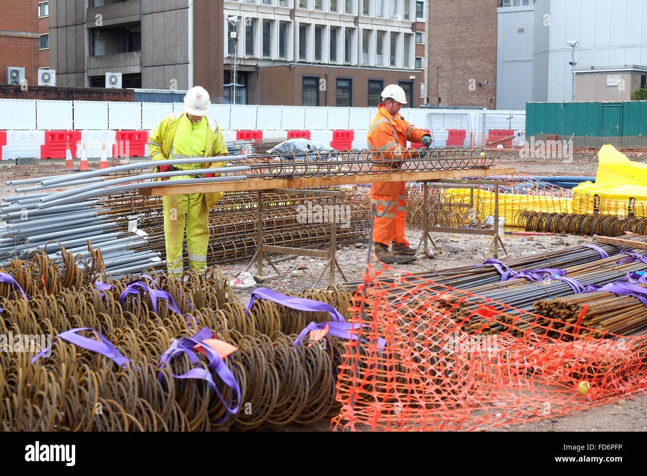 Two construction workers on a site in Cardiff, Wales, UK February 2016 ...