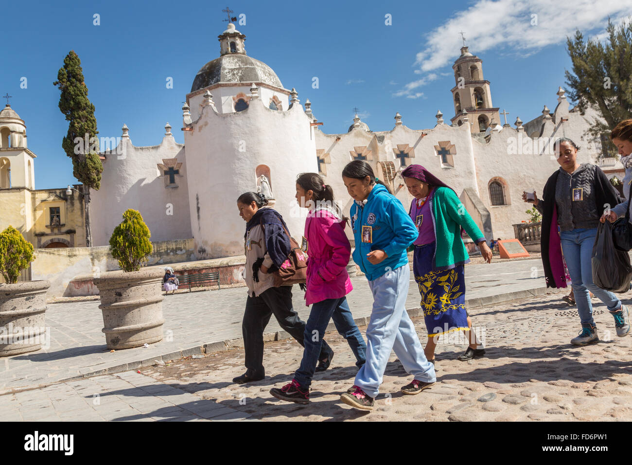 Indigenous pilgrims holds a procession past the Sanctuary of Atotonilco ...