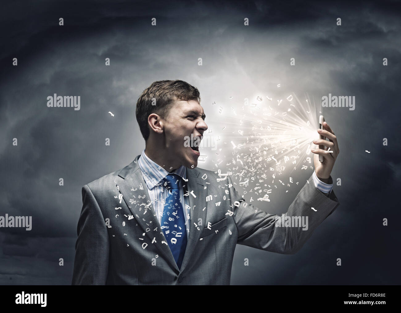 Angry businessman screaming i to mobile furiously phone Stock Photo - Alamy