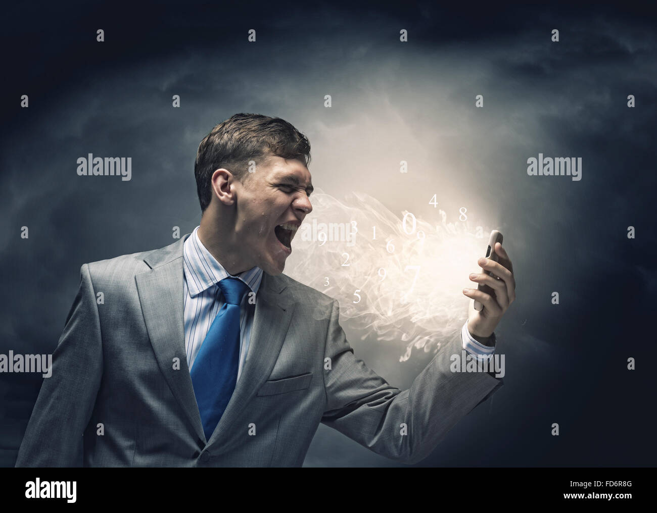 Angry businessman screaming i to mobile furiously phone Stock Photo - Alamy