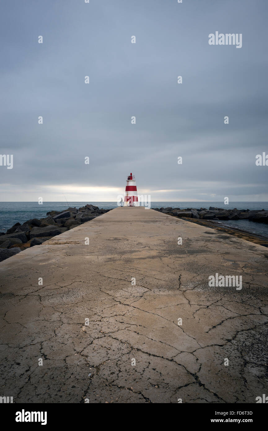 causeway leading out to a lighthouse Stock Photo - Alamy