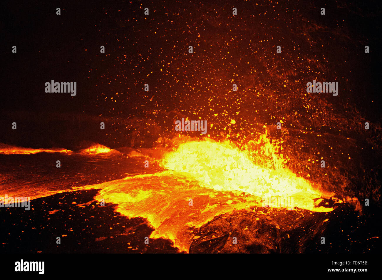 Explosion on the permanent lava lake of the Erta Ale volcano at night ...